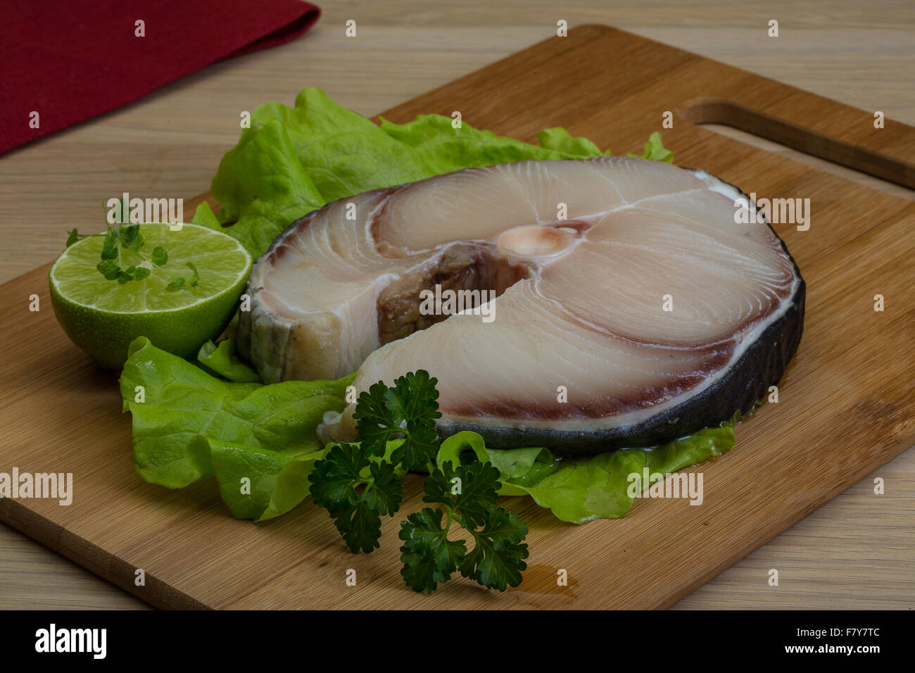 Raw blue shark steak with salad leaves and lime Stock Photo - Alamy