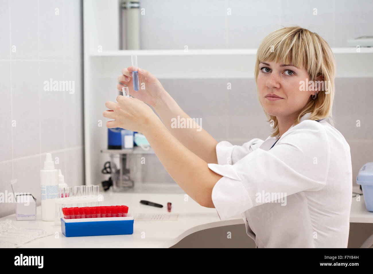 Woman doctor with test tube in laboratory Stock Photo - Alamy
