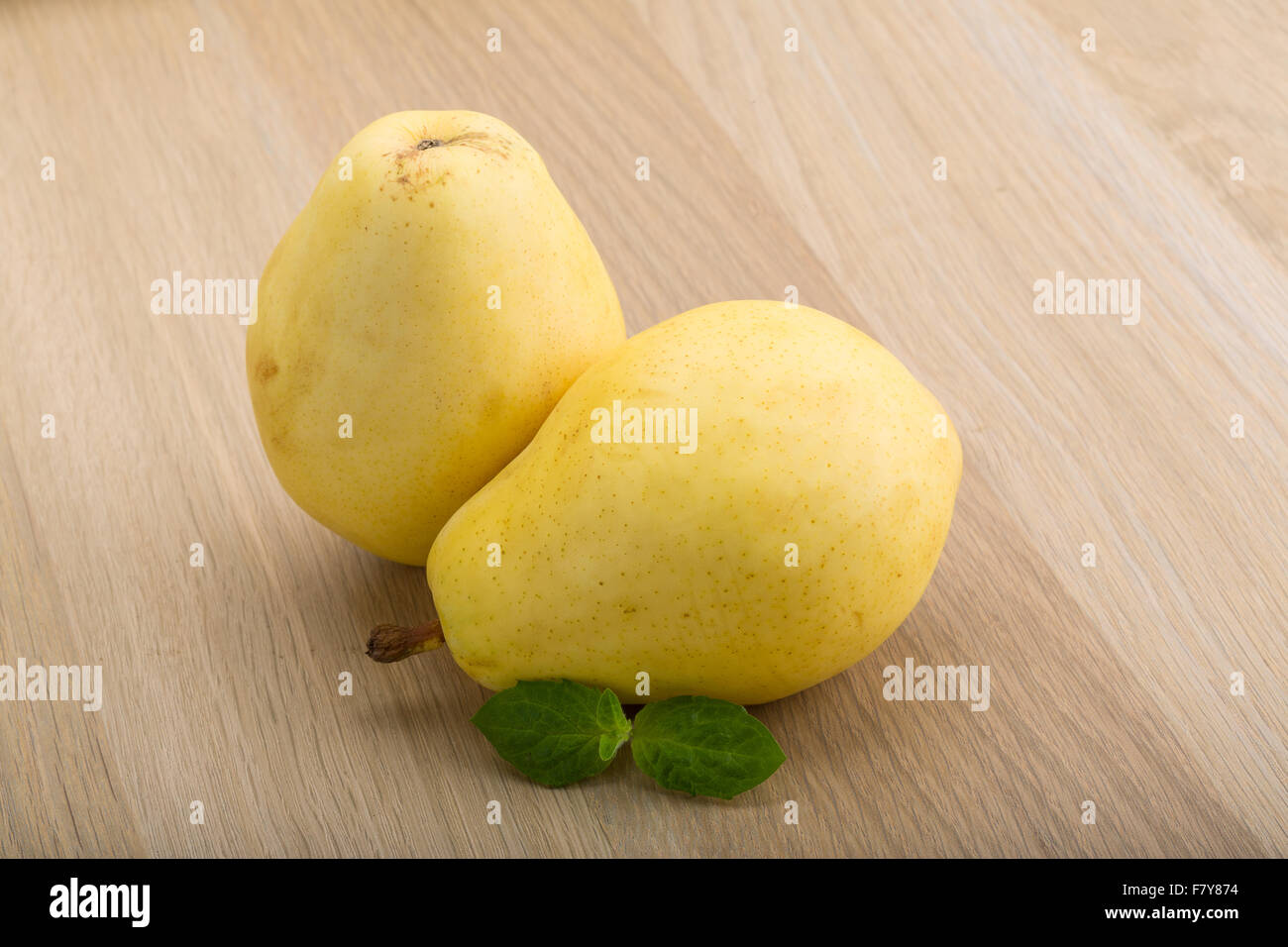 Bright ripe Yellow pears with mint leaves Stock Photo - Alamy