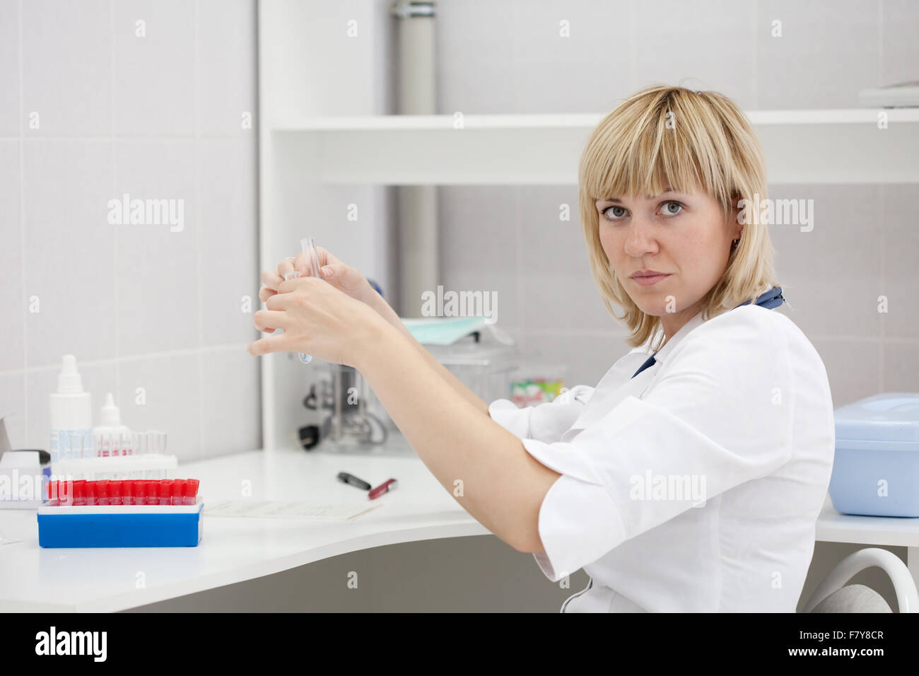 Female doctor with test tube making research Stock Photo - Alamy