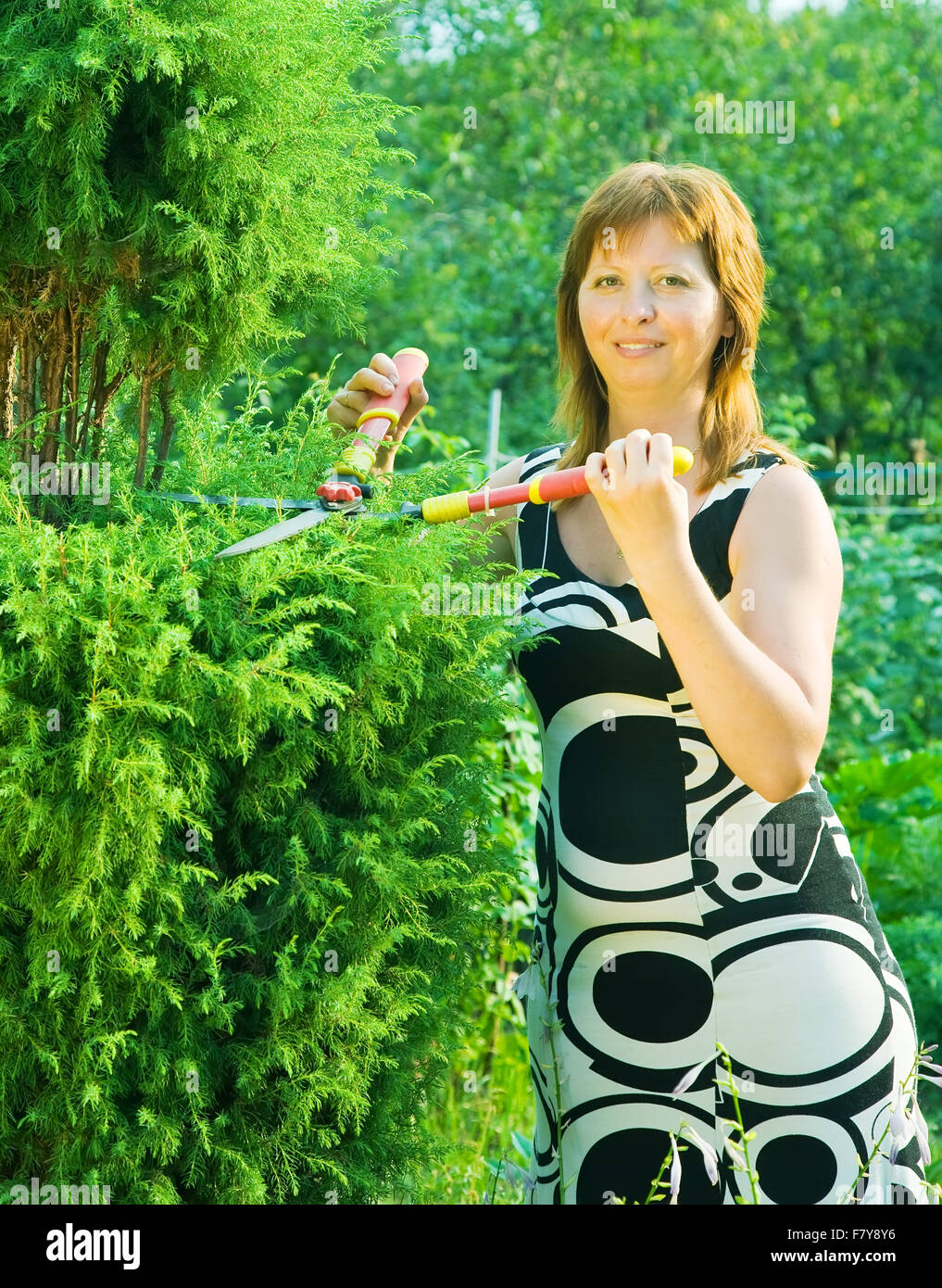 Woman doing yard work in hi-res stock photography and images - Alamy