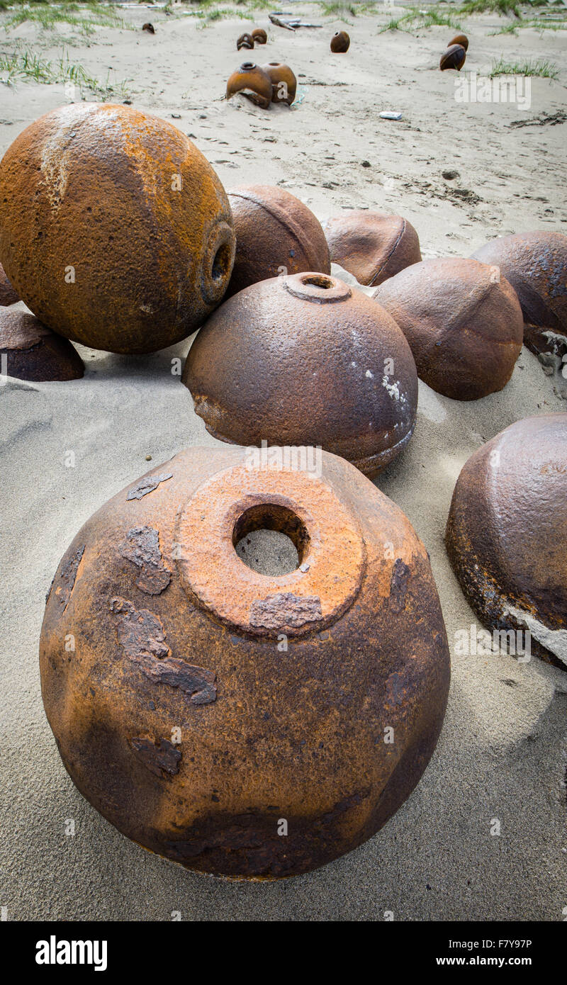 Rusty iron spheres - probably fishing weights - on Bunes beach on the ...