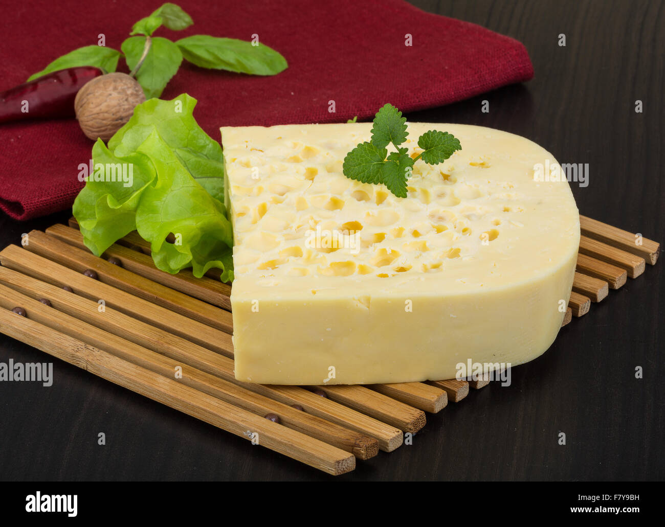 Yellow cheese - maasdam with salad leaves Stock Photo - Alamy