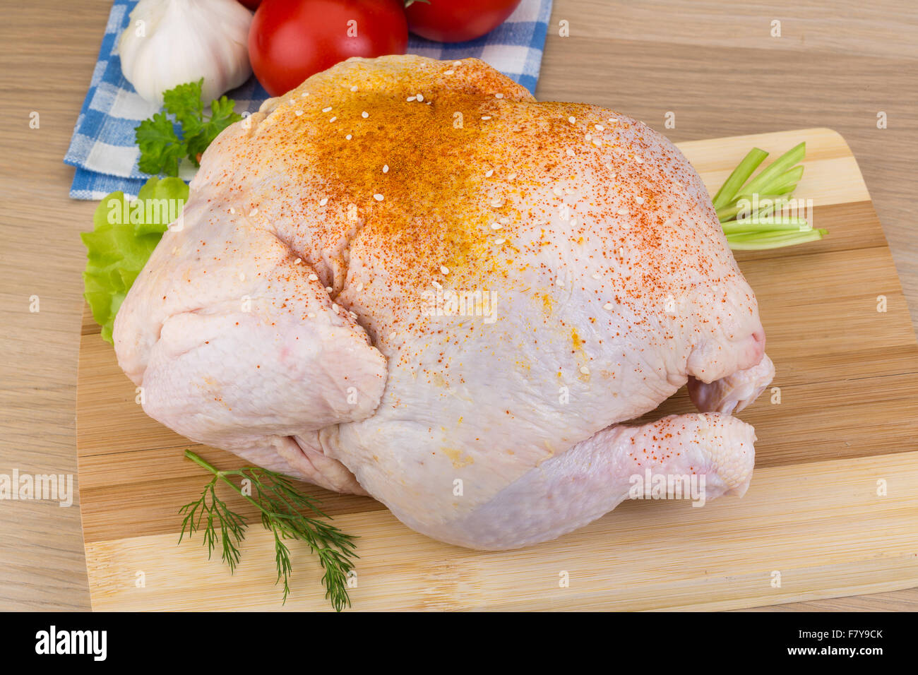 Raw chicken with herbs and spices ready for cooking Stock Photo - Alamy