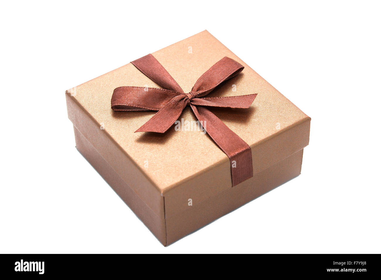Brown gift box with ribbon isolated on white background Stock Photo - Alamy