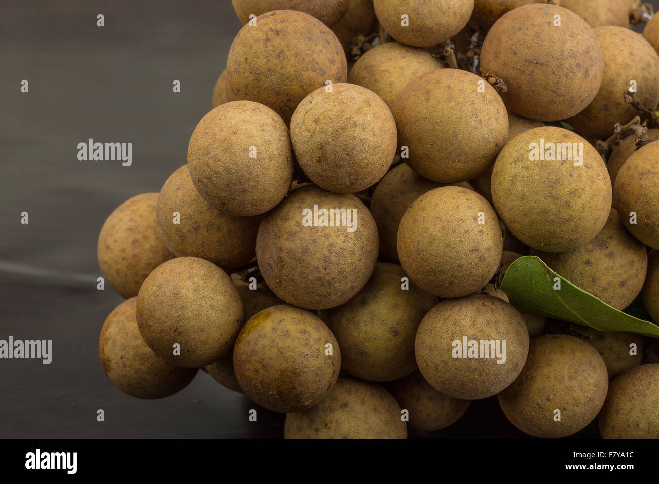 Asian fruit Longan - on wood background Stock Photo - Alamy