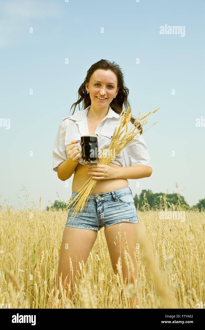 Girl with kvass at cereals field in summer Stock Photo - Alamy
