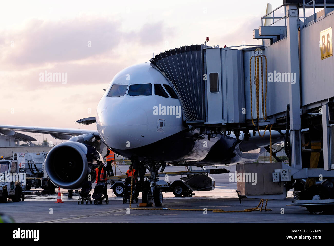 An airbus airplane with jet bridge walkway attached in Ben Gurion ...