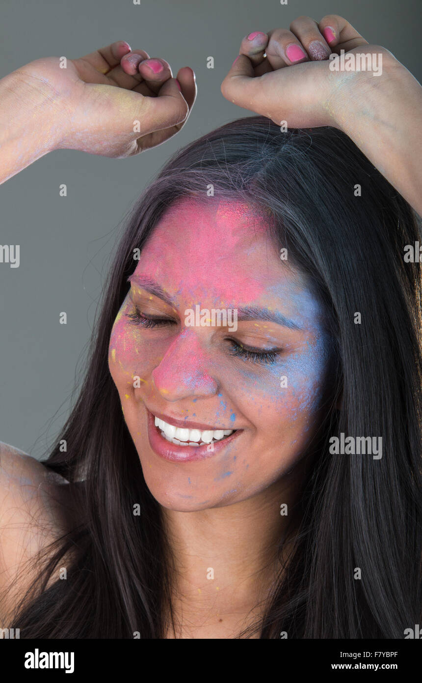 Beautiful young brunette girl with colorful decorated face Stock Photo ...
