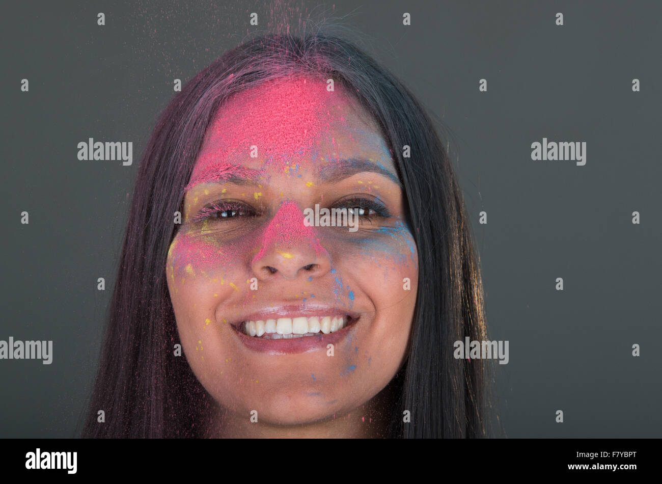 Beautiful young brunette girl with colorful decorated face Stock Photo ...