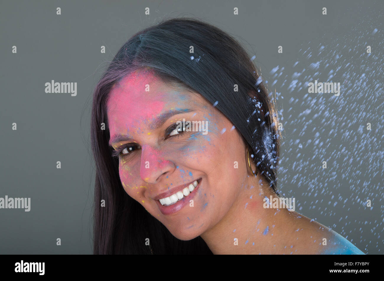 Beautiful young brunette girl with colorful decorated face Stock Photo ...