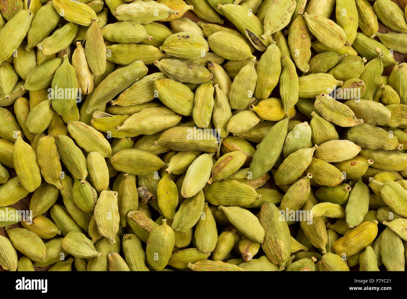 Cardamom seed pods frame filling top view background Stock Photo - Alamy