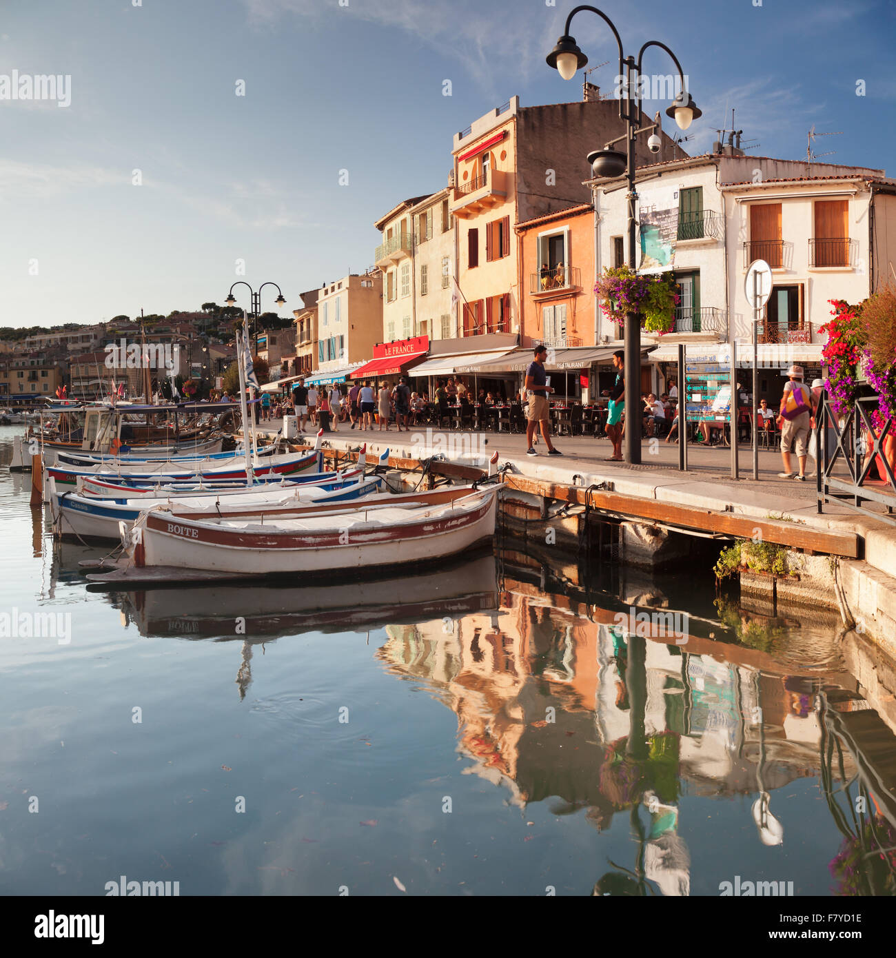 Harbour promenade reflected in water, Cassis, Provence, Provence-Alpes ...