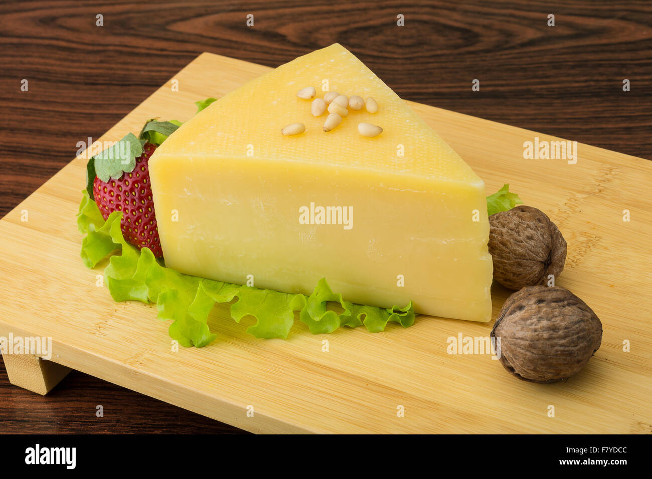 Parmesan cheese triangle with strawberry and wallnuts Stock Photo - Alamy