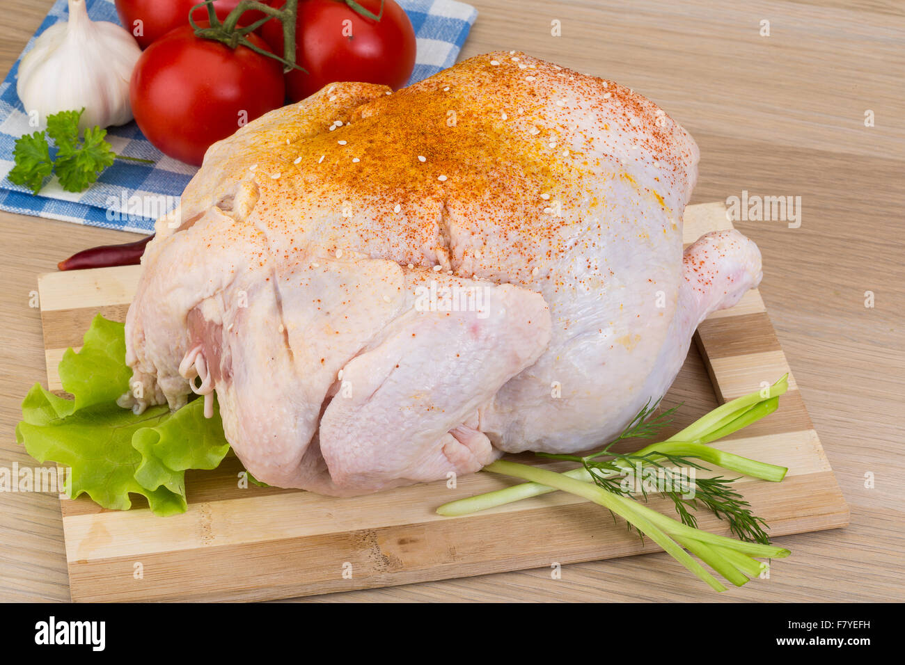 Raw chicken with herbs and spices ready for cooking Stock Photo - Alamy