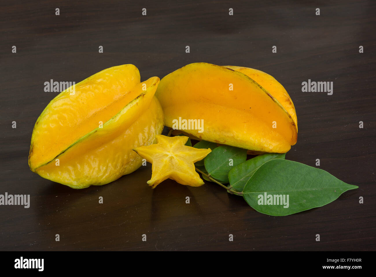 Asian fruit Carambola with leaves - for styling food Stock Photo - Alamy