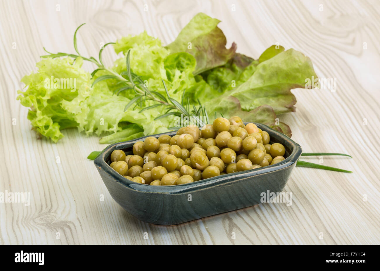 Marinated peas - in the bowl with salad leaves Stock Photo - Alamy