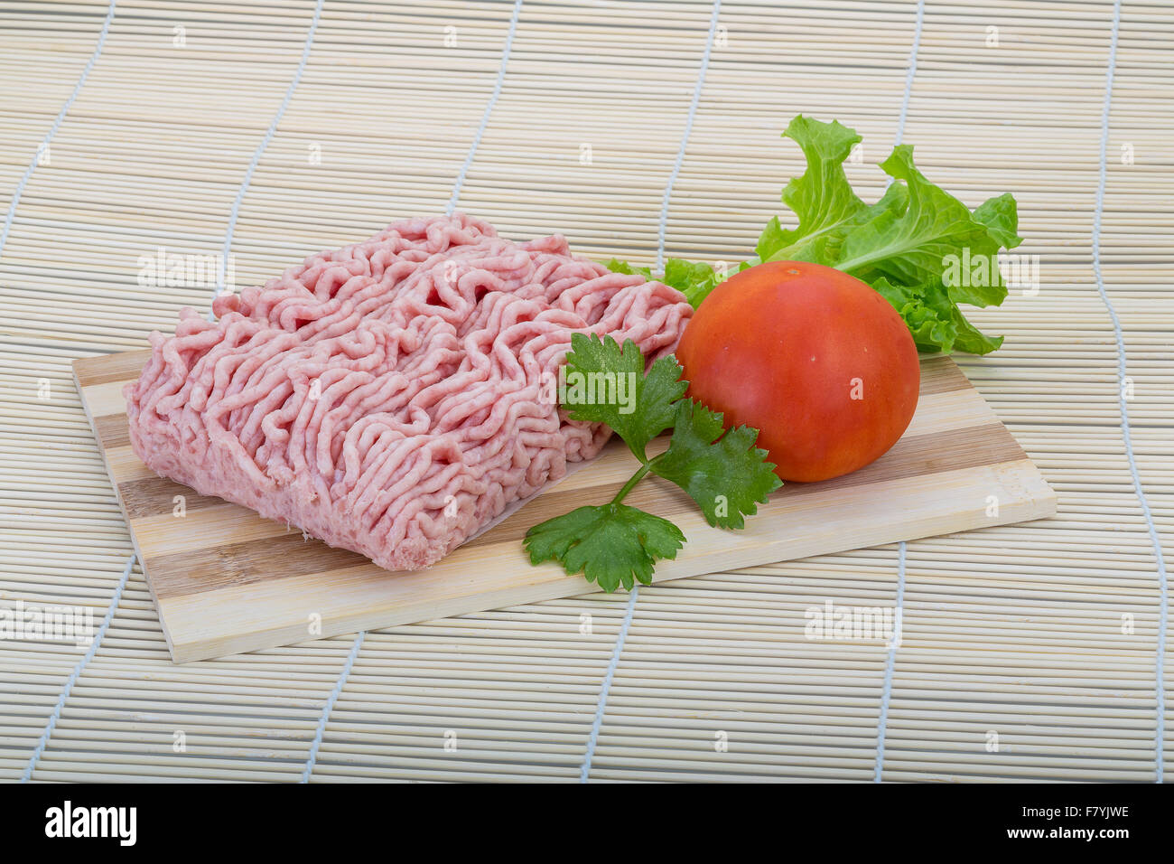 Raw minced pork meat on the desk with herbs Stock Photo - Alamy