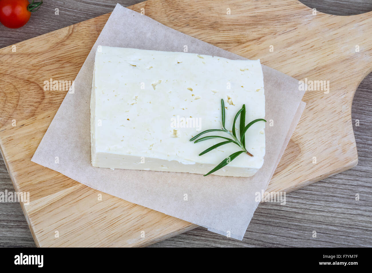 Traditional Caucasian homemade Cheese Brinza with rosemary on wood ...