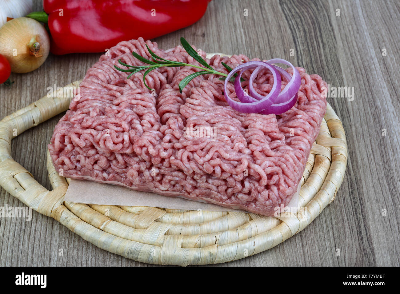 Raw minced pork meat with onion and rosemary ready for cooking Stock ...