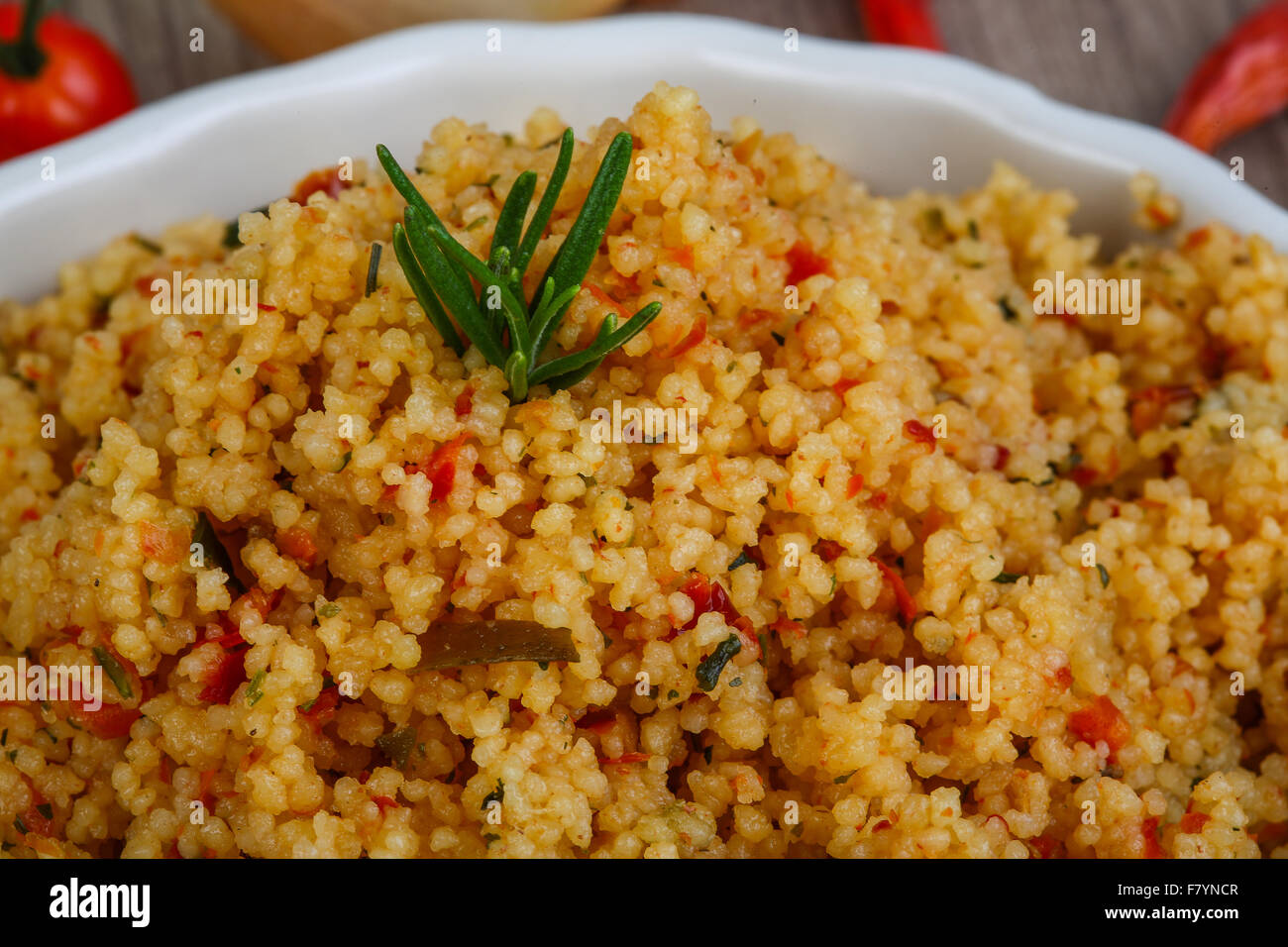 Arabic traditional cuisine - Couscous with tomato and green onion Stock ...