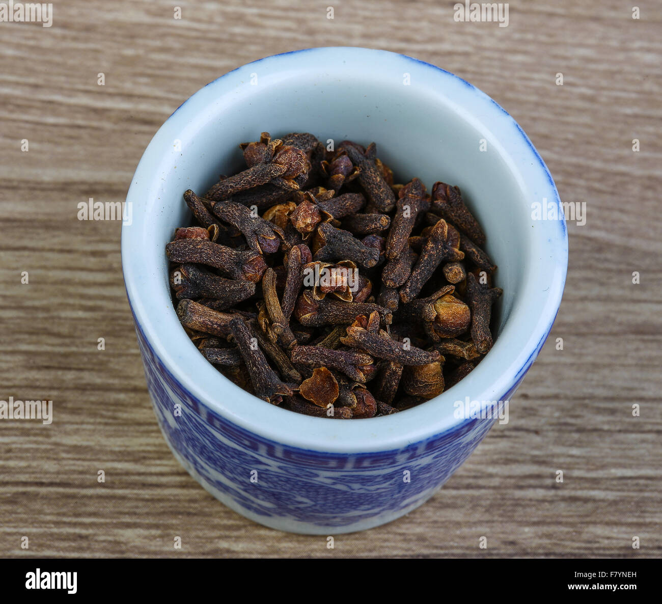 Aromatic Dried Cloves seeds on the wood background Stock Photo - Alamy