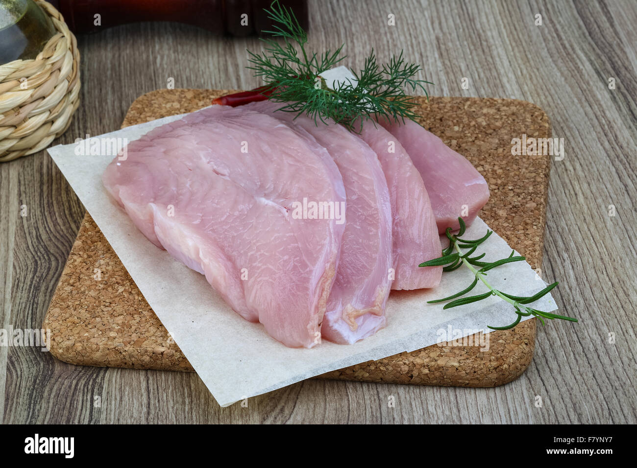 Fresh Raw turkey steak with dill leaves and hot pepper Stock Photo - Alamy