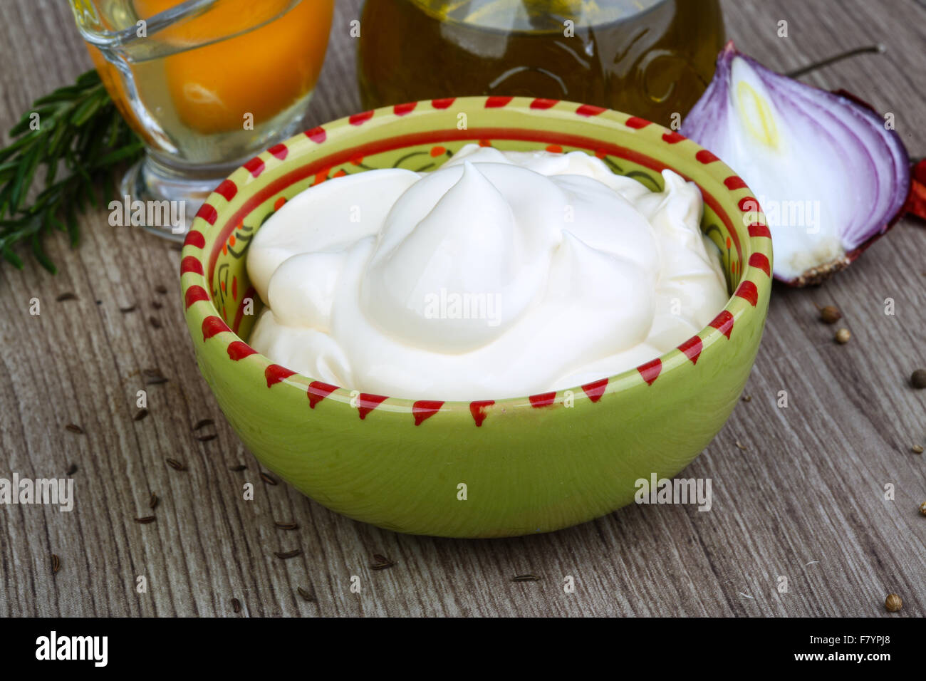 Mayonnaise sauce served raw egg, olive oil and rosemary Stock Photo - Alamy
