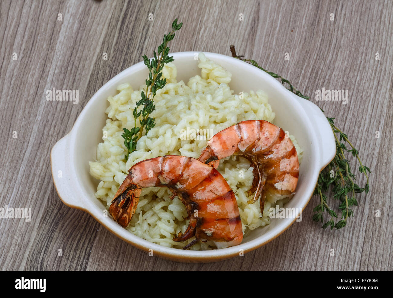 Italian trditional Risotto with tiger prawn and thyme Stock Photo - Alamy