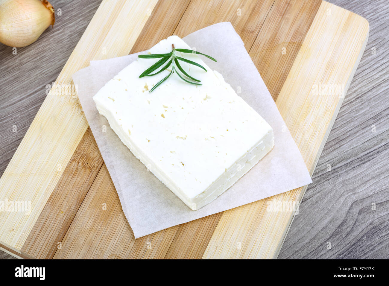 Traditional Caucasian homemade Cheese Brinza with rosemary on wood ...