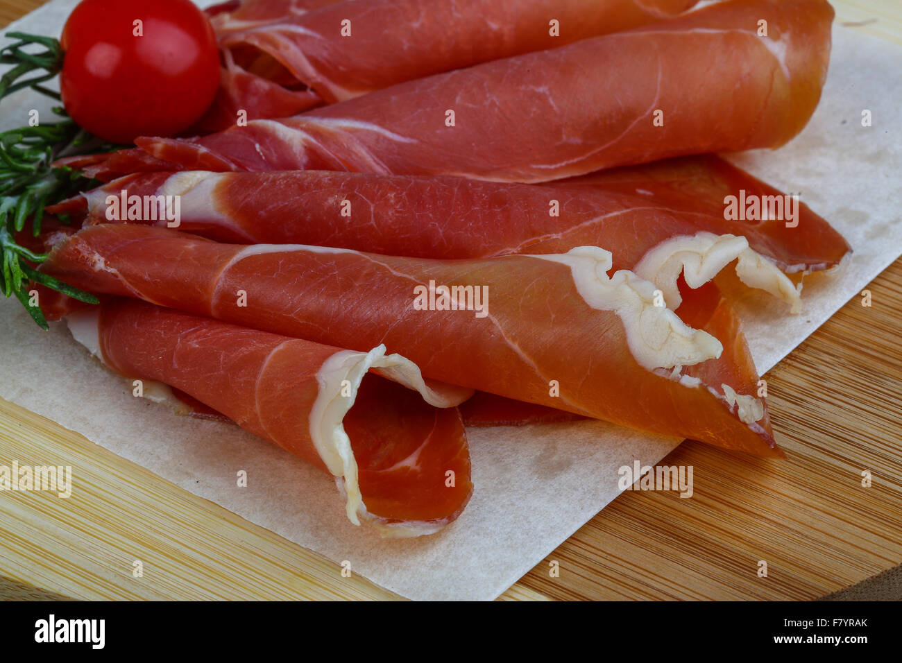 Spanish traditional snack - Jamon with tomato and rosemary Stock Photo ...