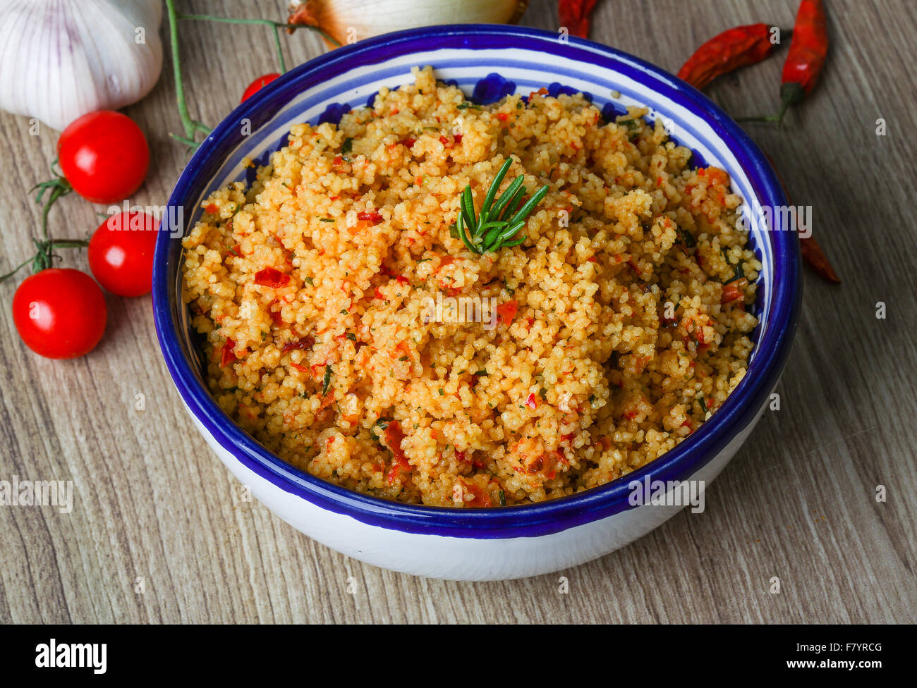 Arabic traditional cuisine - Couscous with tomato and green onion Stock ...