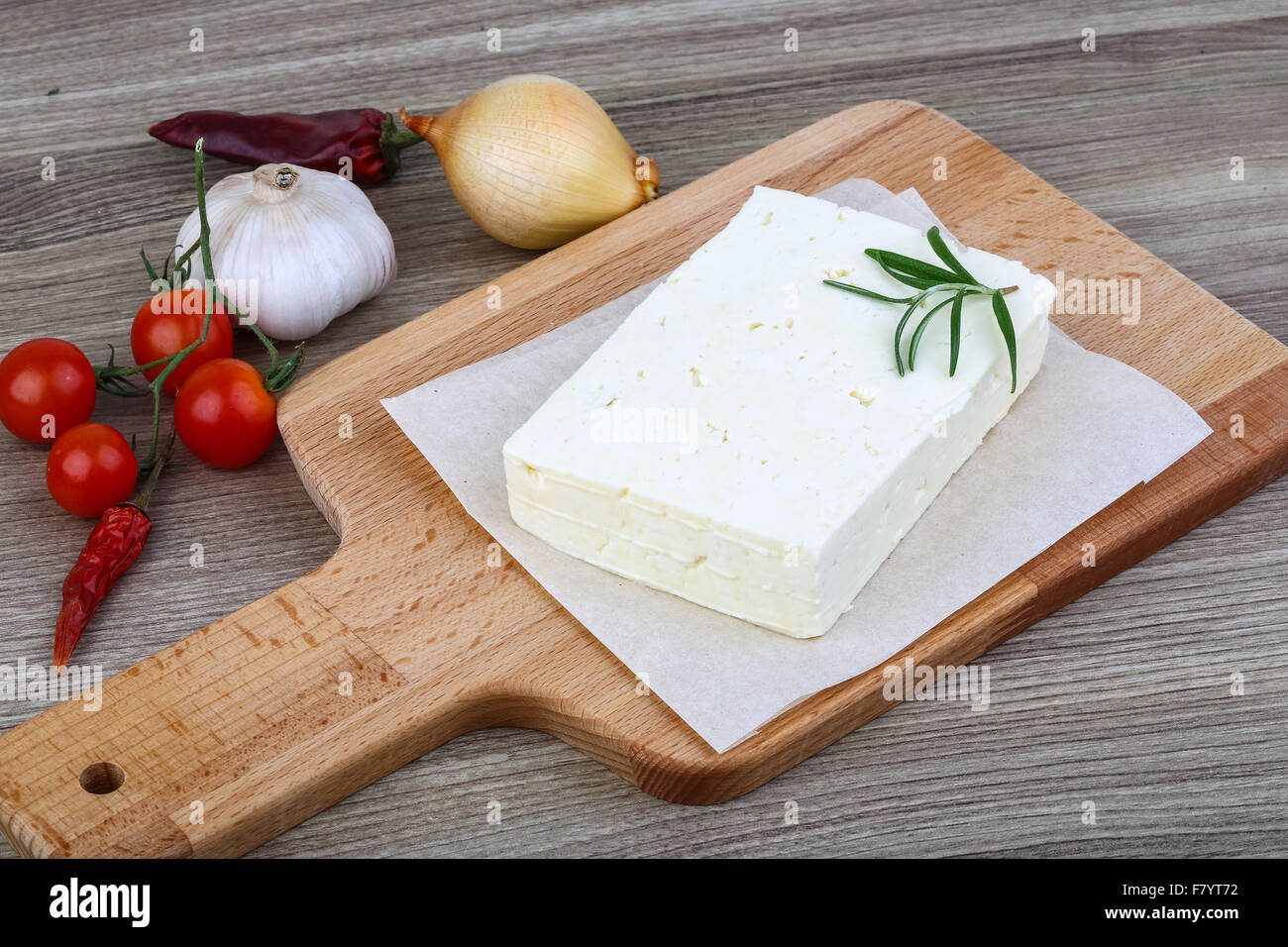 Traditional Caucasian homemade Cheese Brinza with rosemary on wood ...
