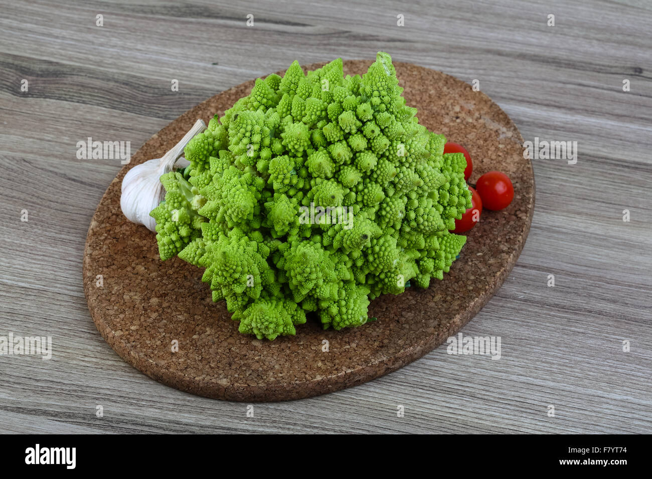 Romanesco exotic cabbage on the wood background Stock Photo - Alamy