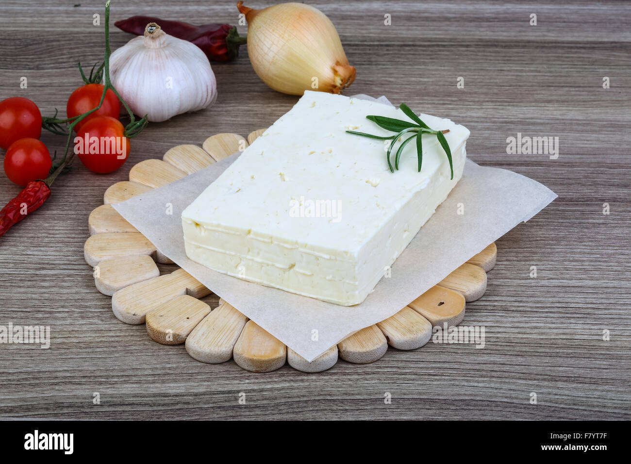 Traditional Caucasian homemade Cheese Brinza with rosemary on wood ...