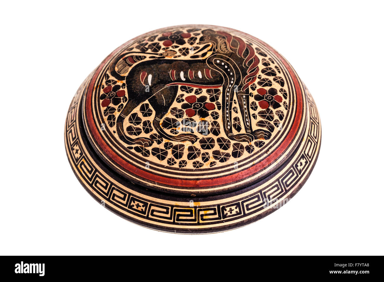 a small round ancient decorated ceramic box isolated over a white ...