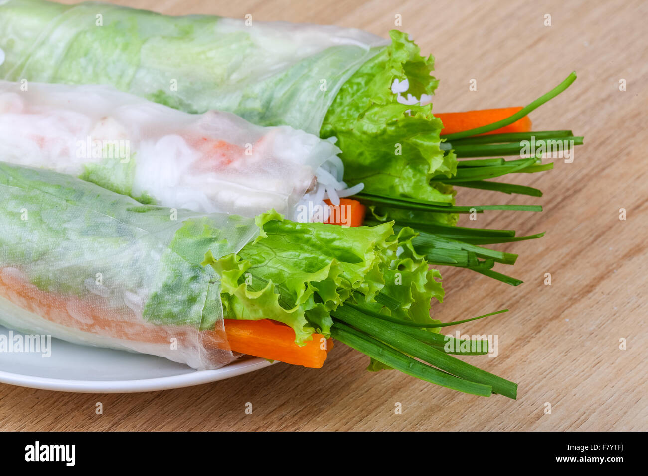 Asian traditional spring rolls on the wood background Stock Photo - Alamy