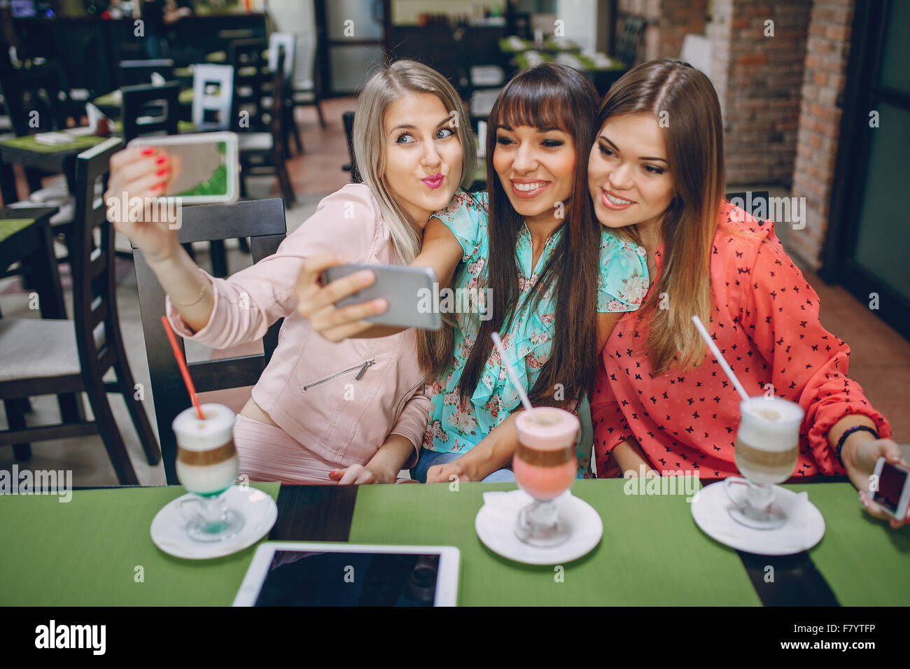 Girls with phones Stock Photo - Alamy