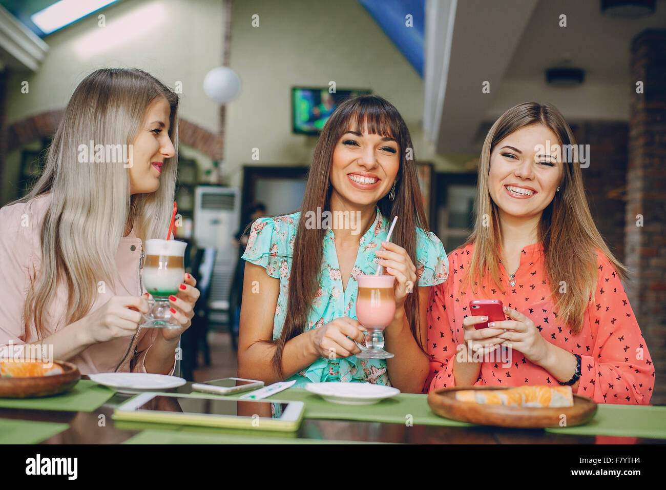 Girls with phones Stock Photo - Alamy