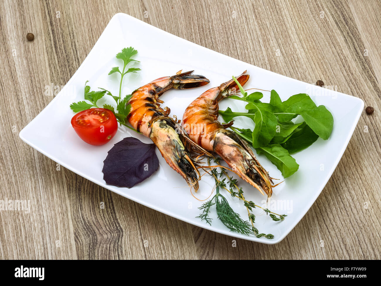 Roasted tiger shrimps with thyme and basil leaves Stock Photo - Alamy