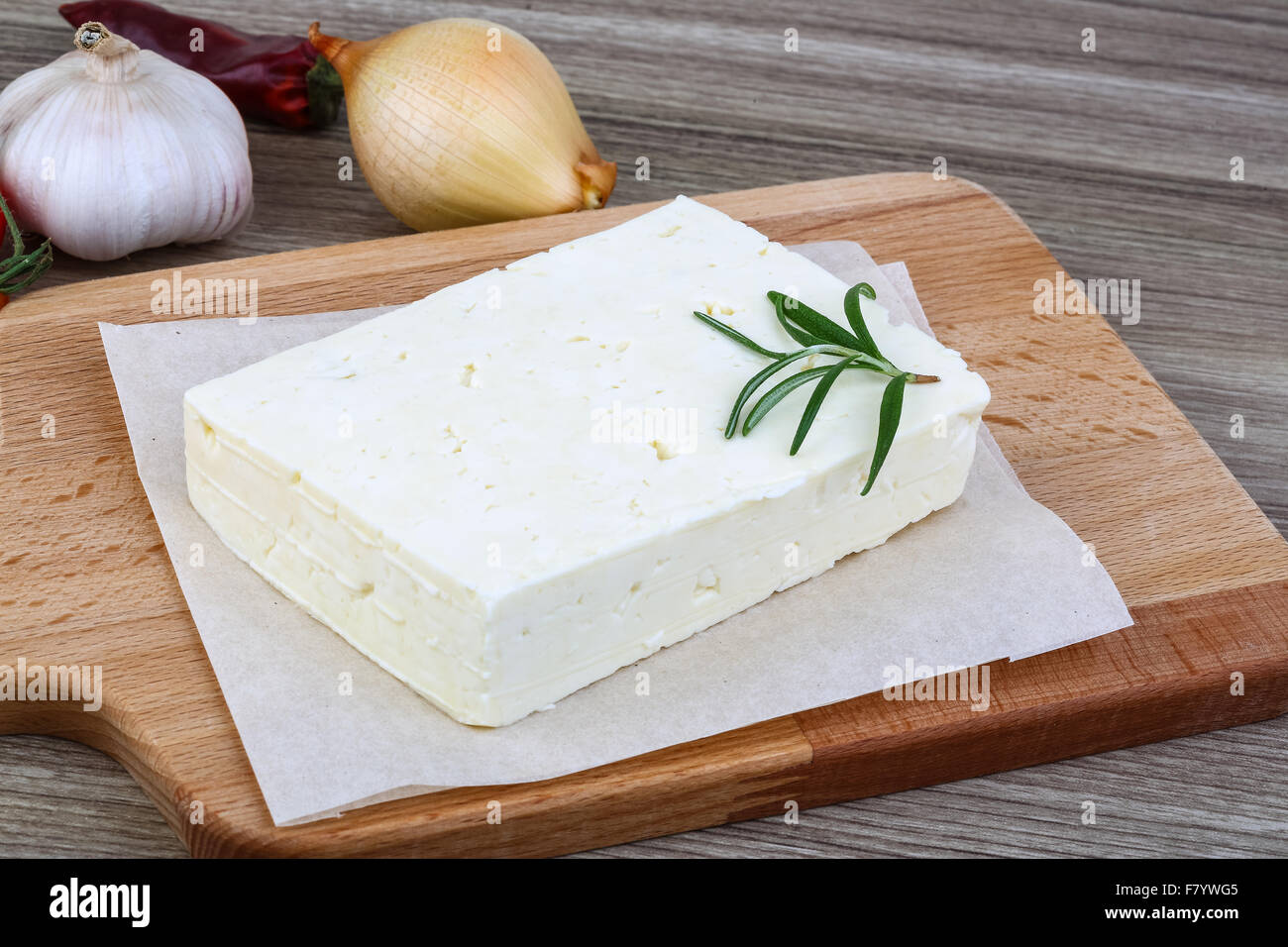 Traditional Caucasian homemade Cheese Brinza with rosemary on wood ...