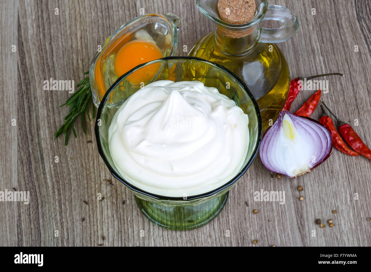 Mayonnaise sauce served raw egg, olive oil and rosemary Stock Photo - Alamy
