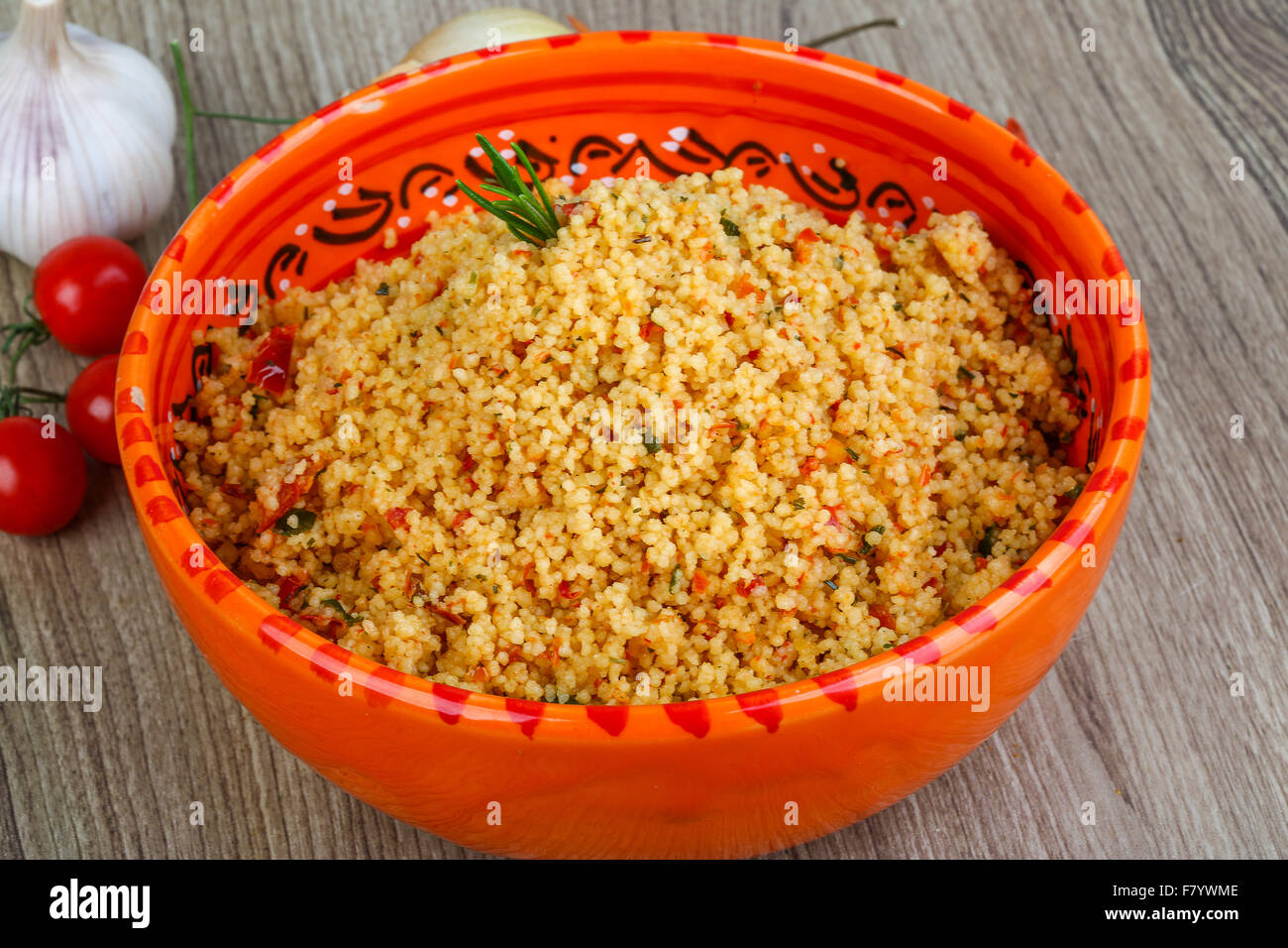 Arabic traditional cuisine - Couscous with tomato and green onion Stock ...