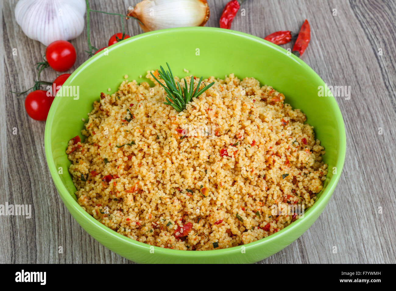 Arabic traditional cuisine - Couscous with tomato and green onion Stock ...