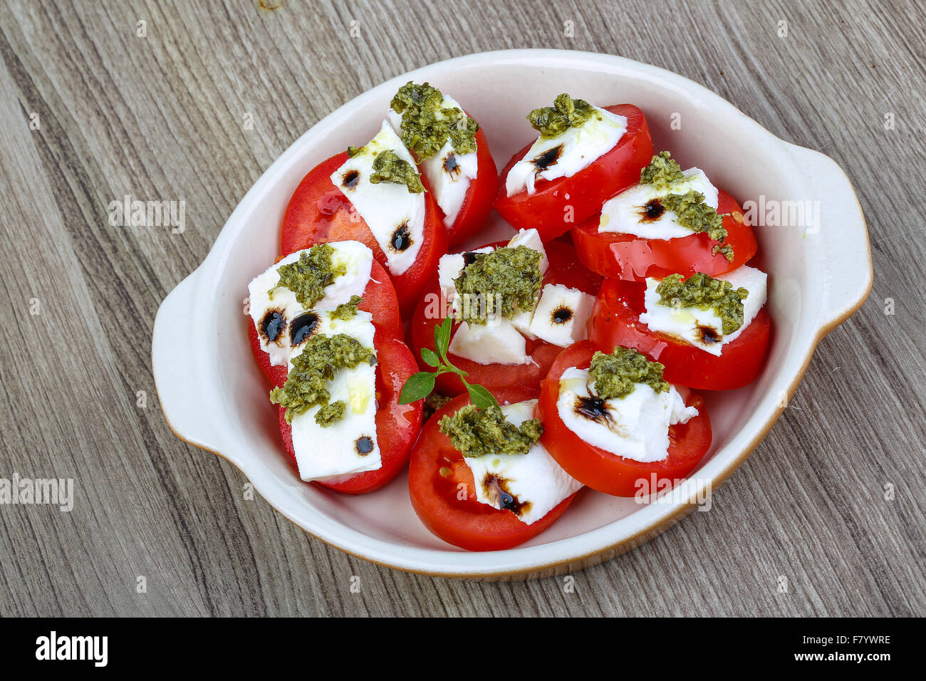 Traditional Italian Caprese salad on the wood background Stock Photo ...