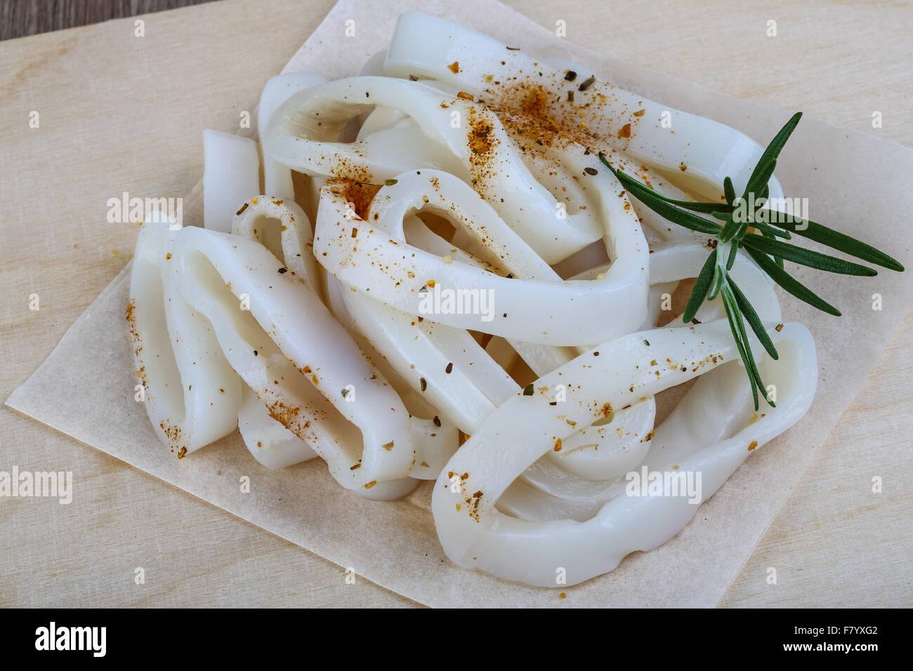 Raw squid rings herbs hi-res stock photography and images - Alamy