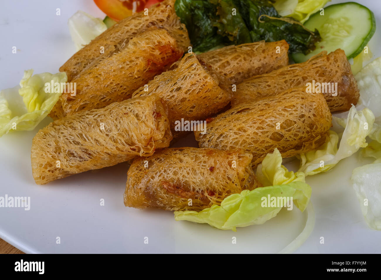 Asian traditional spring rolls on the wood background Stock Photo - Alamy