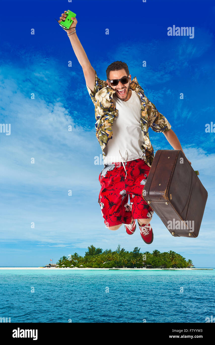 a young, attractive male in a colorful outfit in a tropical island ...
