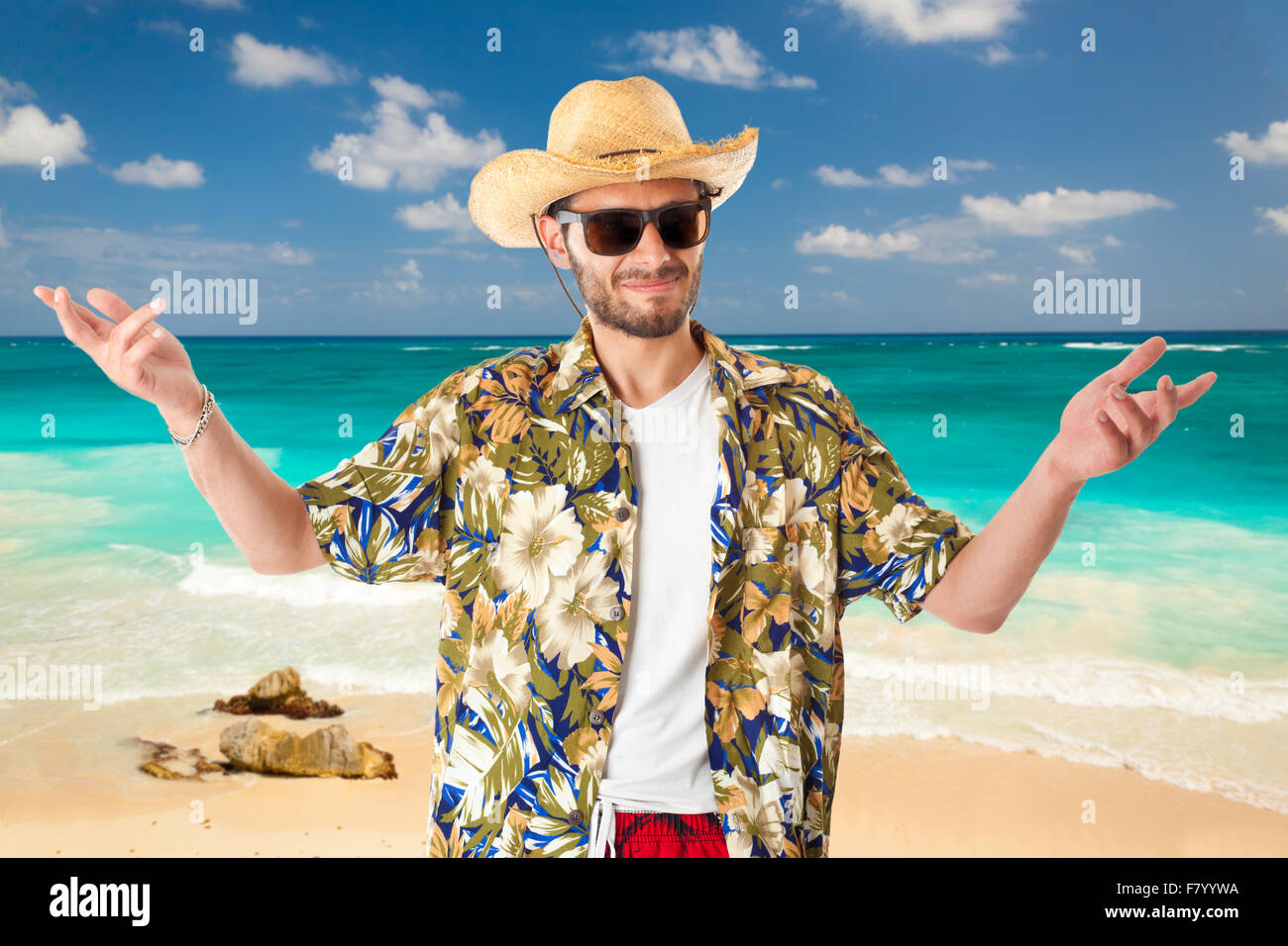 a young, attractive male in a colorful outfit in a tropical island ...