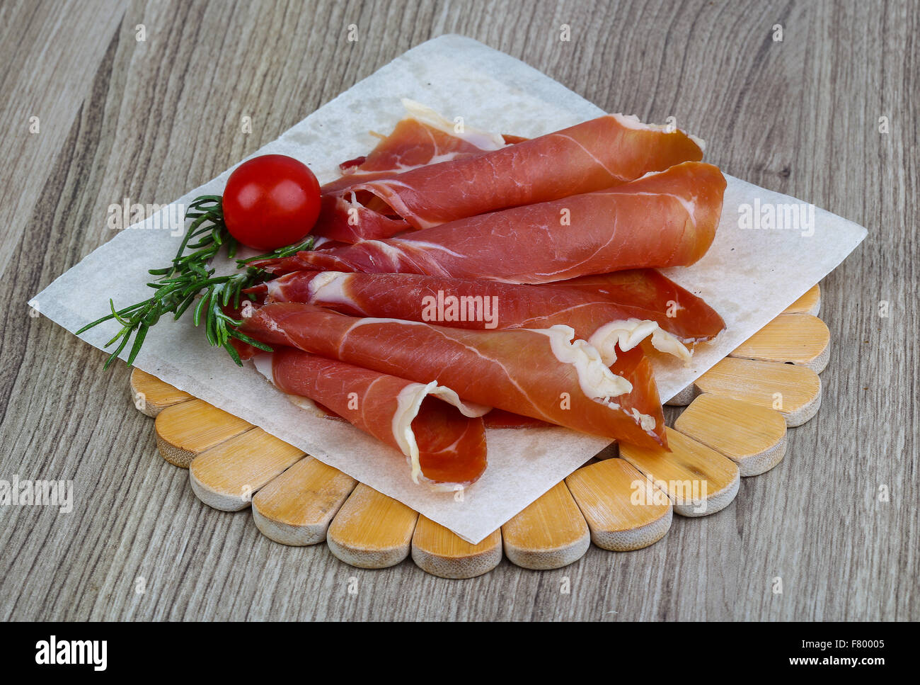Spanish traditional snack - Jamon with tomato and rosemary Stock Photo ...